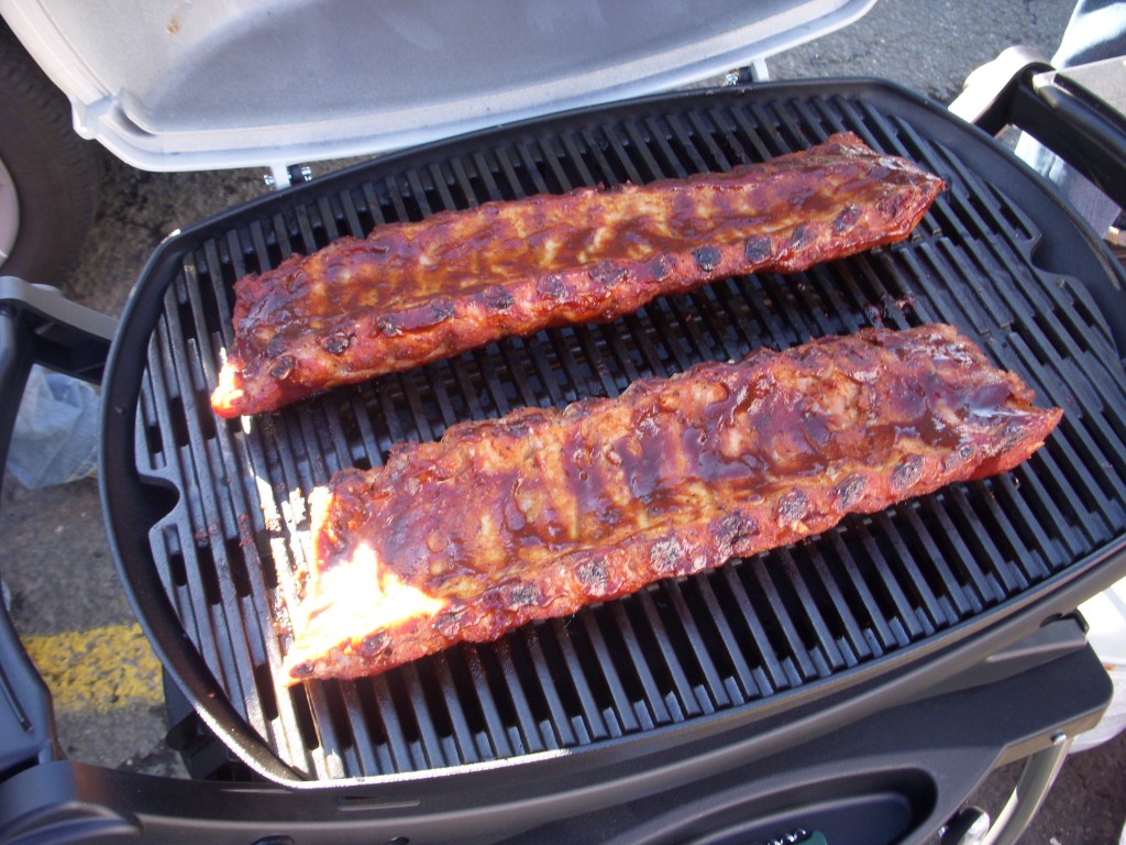 Two giant racks of ribs on the grill