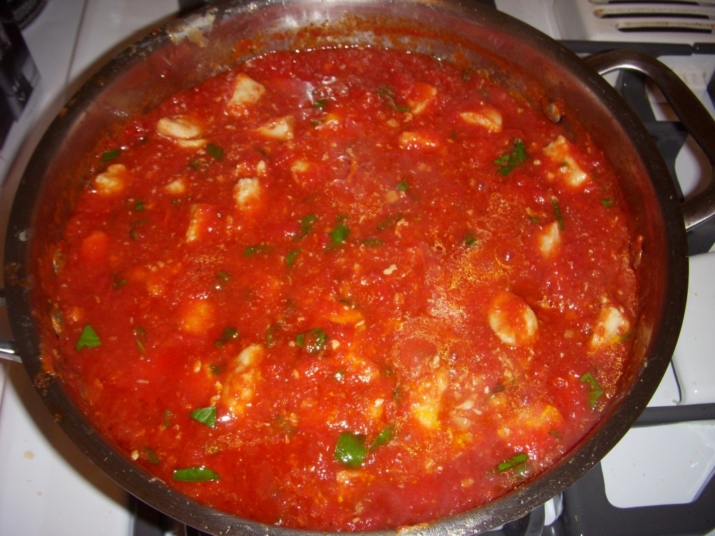 Simmering the tomato sauce with vodka